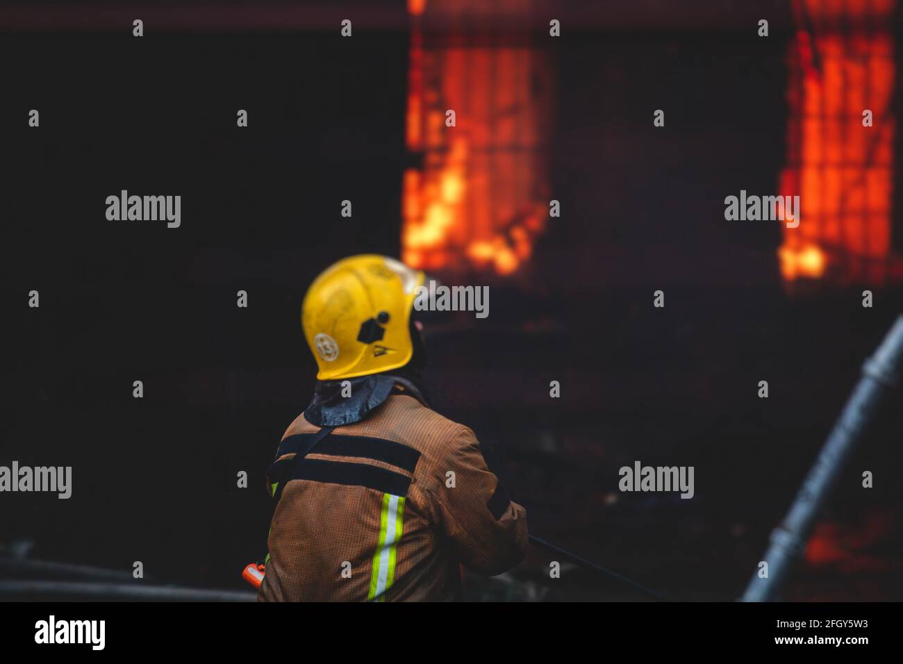 Firefighters put out large massive fire blaze, group of fire men in ...