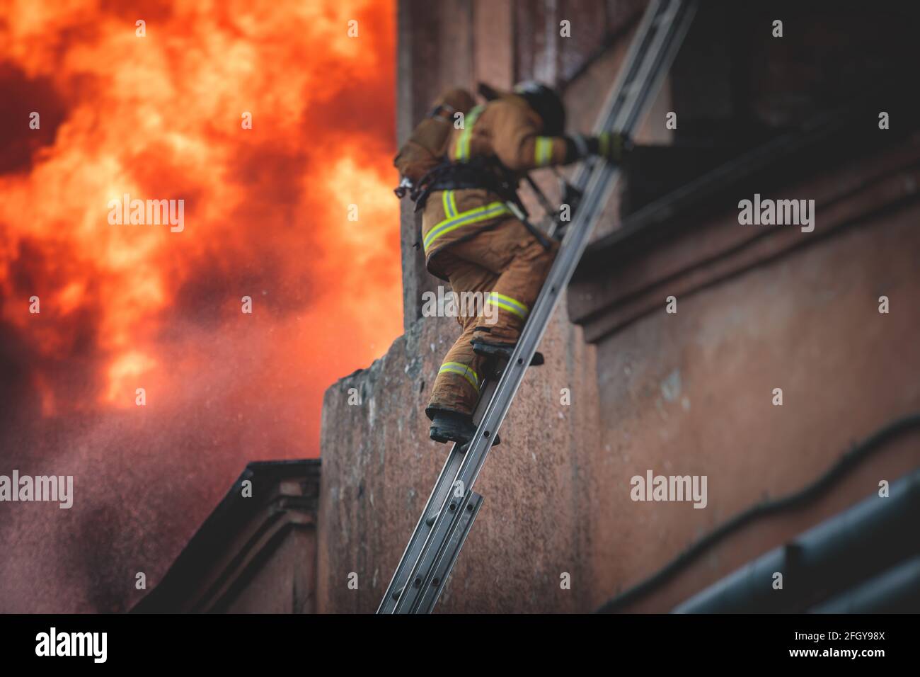 Massive large blaze fire in the city, brick factory building on fire ...