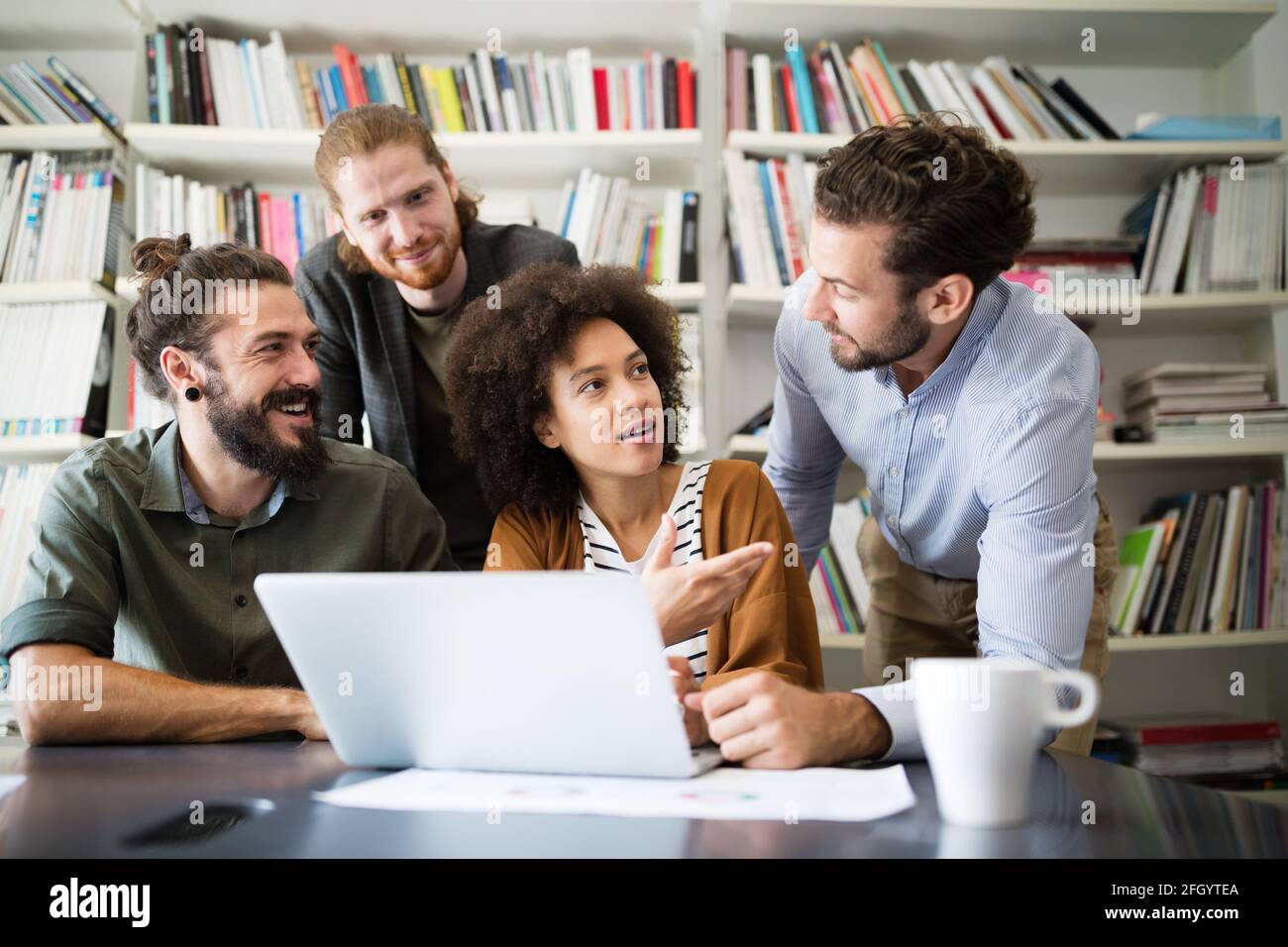 Programmers cooperating at IT company developing apps Stock Photo - Alamy