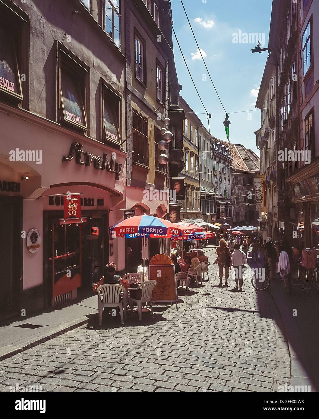 Colourful street scene with Al Fresco pavement cafes in the city of ...