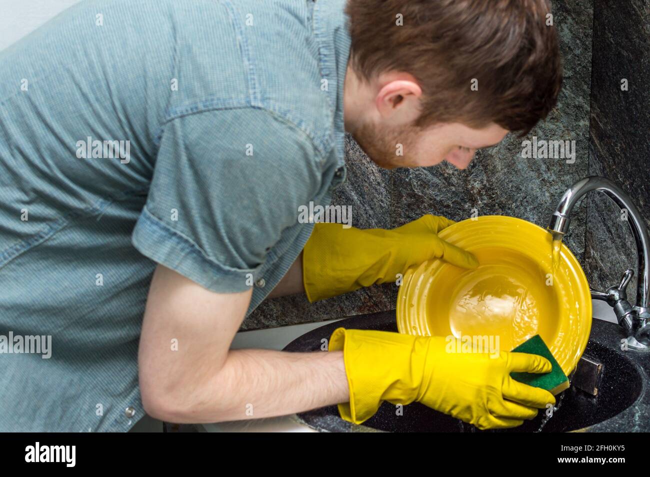 Close up man washing dishes hi-res stock photography and images - Alamy