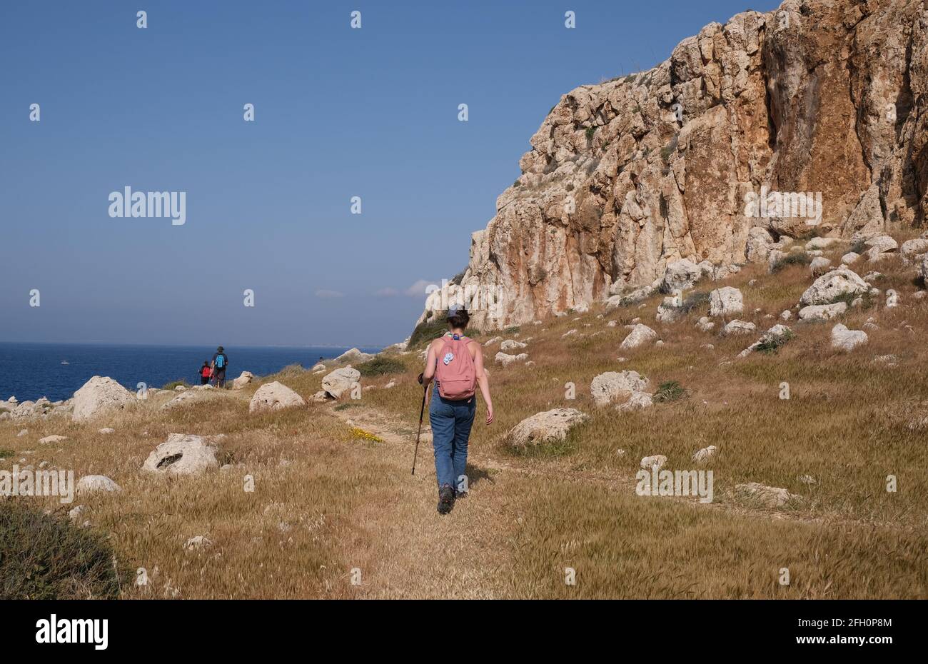 Group of unrecognised people hiking in nature on a trail. Healthy ...