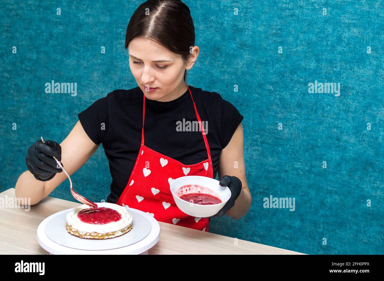 Woman making jam in kitchen hi-res stock photography and images - Alamy