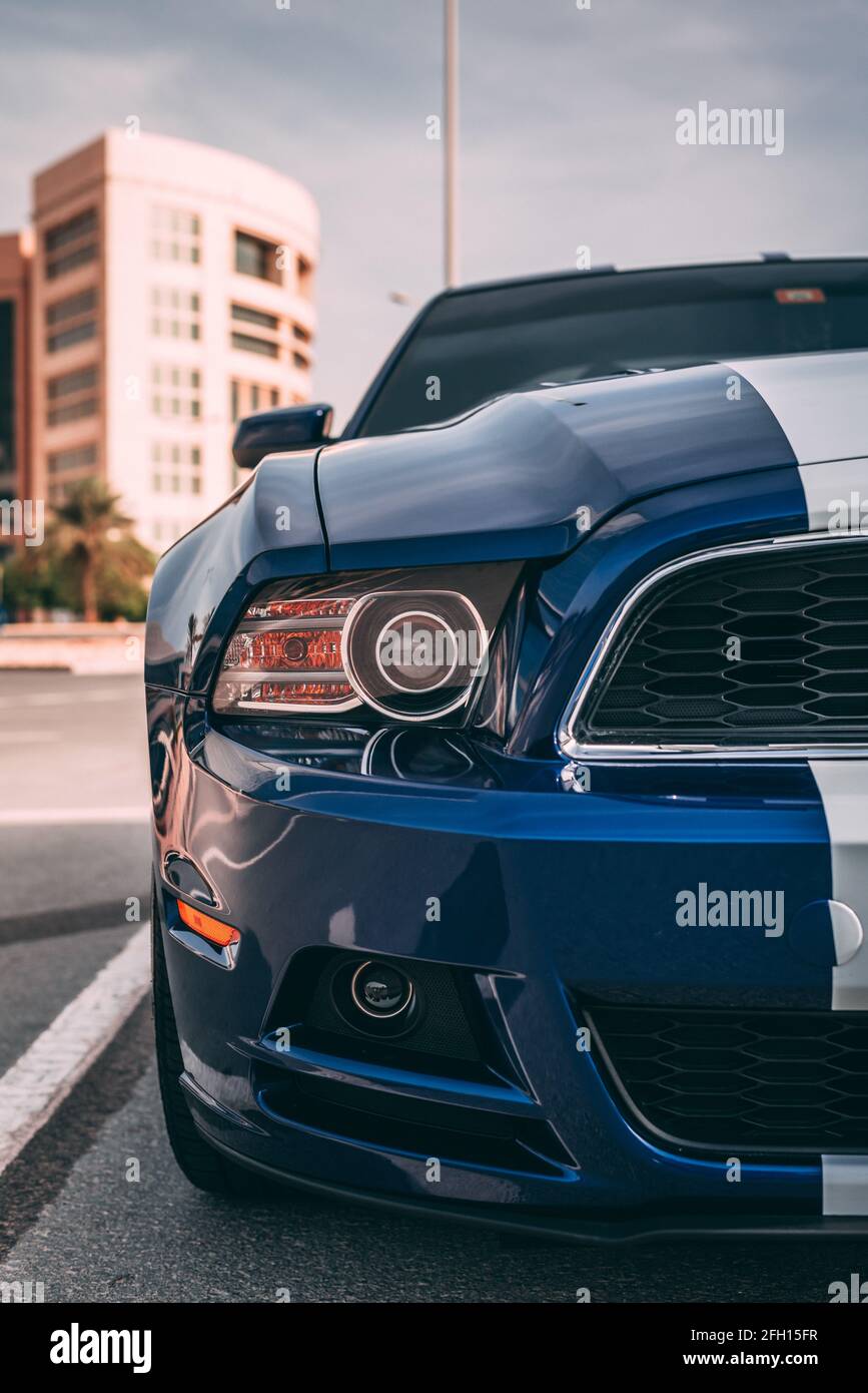 A vertical shot of a modern blue car with led and xenon optics Stock ...
