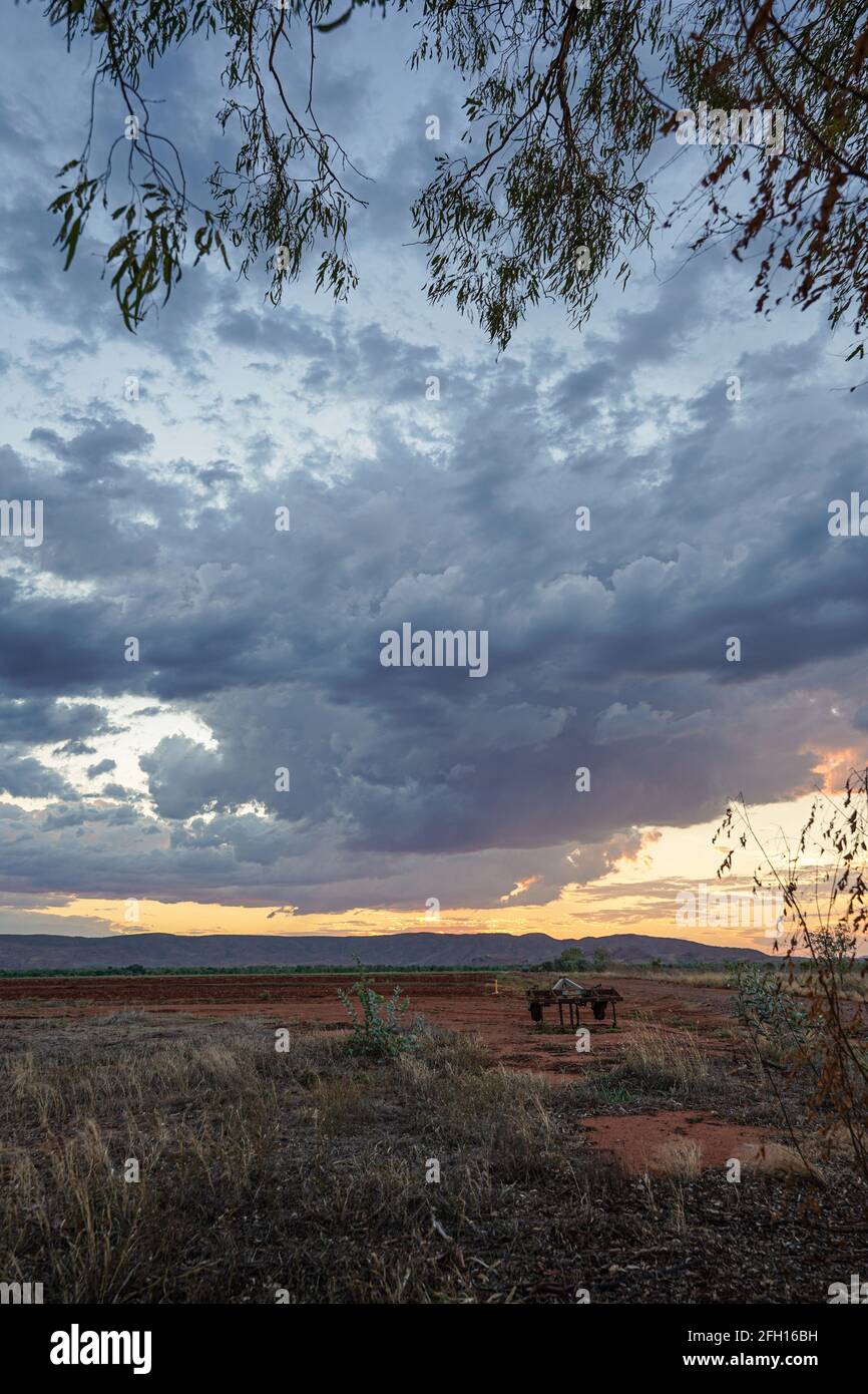 Farm field at sunset time Stock Photo - Alamy