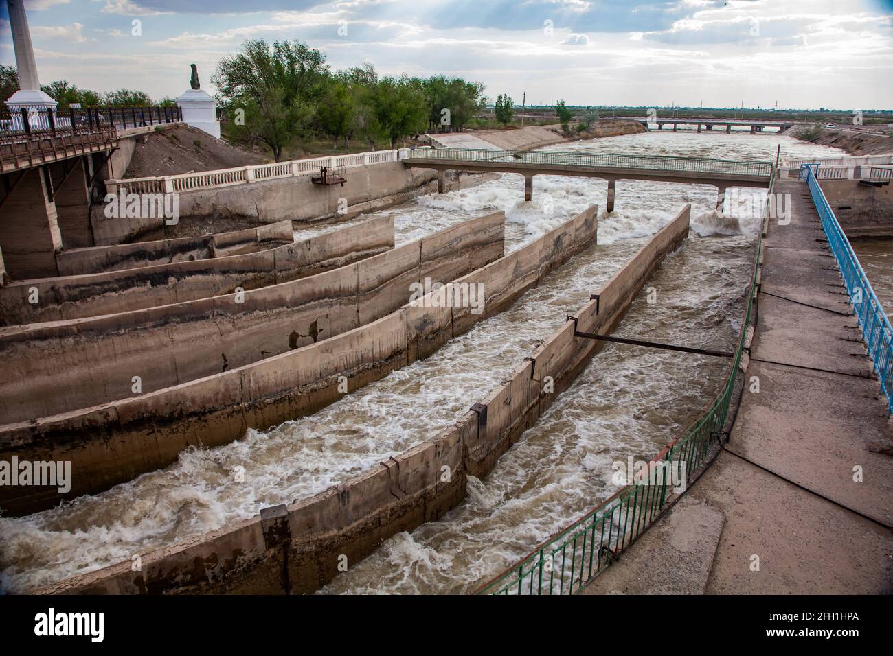 Concrete elements of Shirkeily channel. Dam of Shardara river and ...