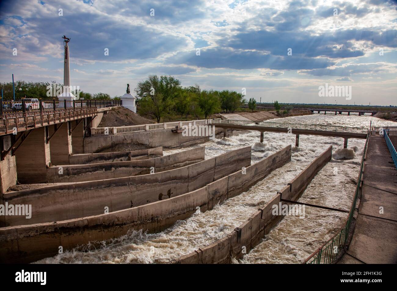 Dam of Shardara river. Concrete elements of Shirkeily channel. Memory ...