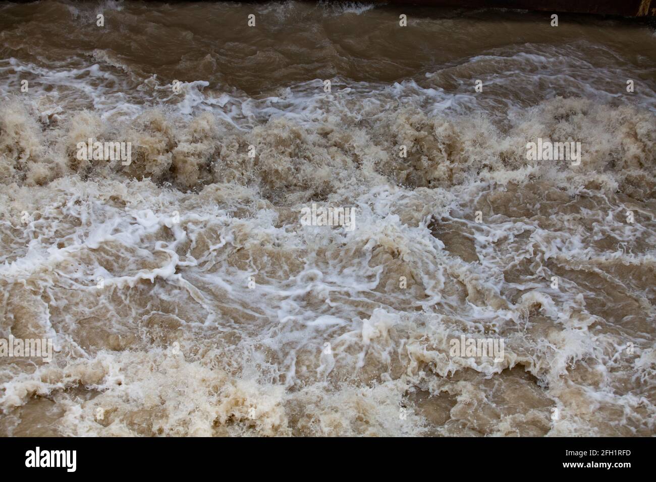 Turbulent water of Shardara river after dam. Close up photo Stock Photo ...