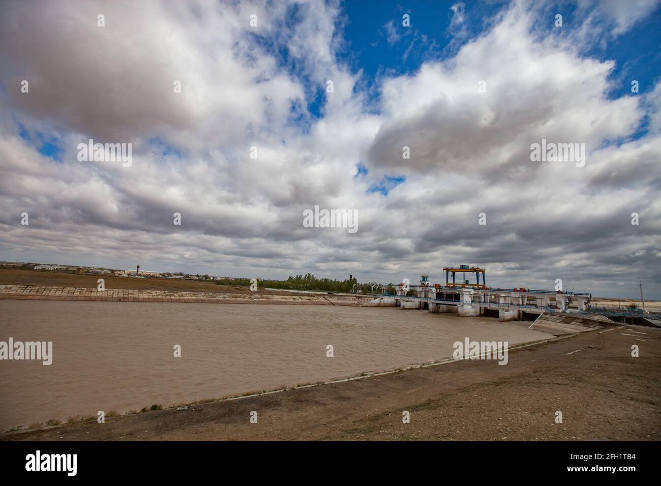 Panorama of Shardara river dam near Kazaly city. Gantry crane on bridge ...