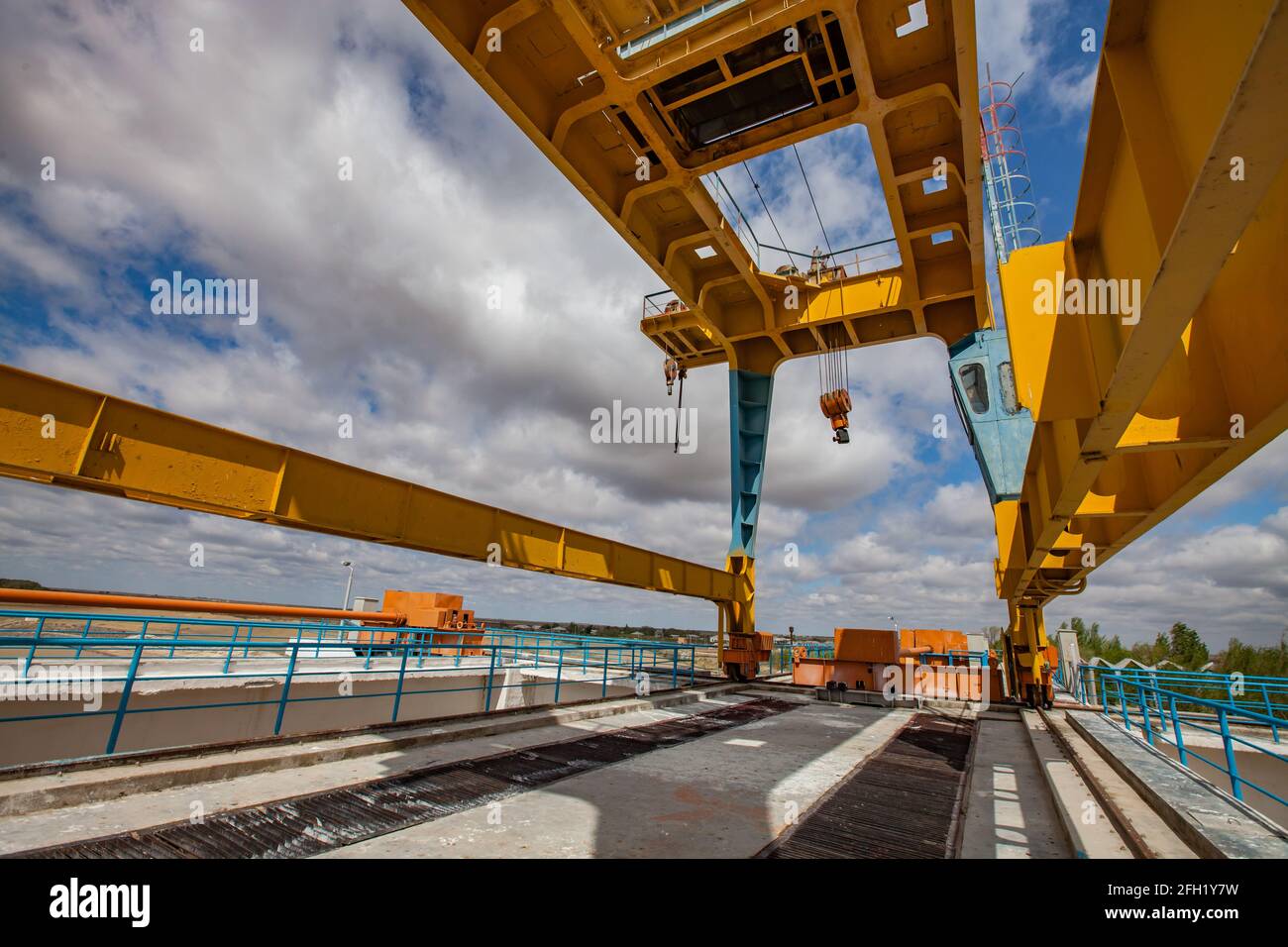 Gentry crane for water shutter lifting on Shardara river dam. blue sky ...