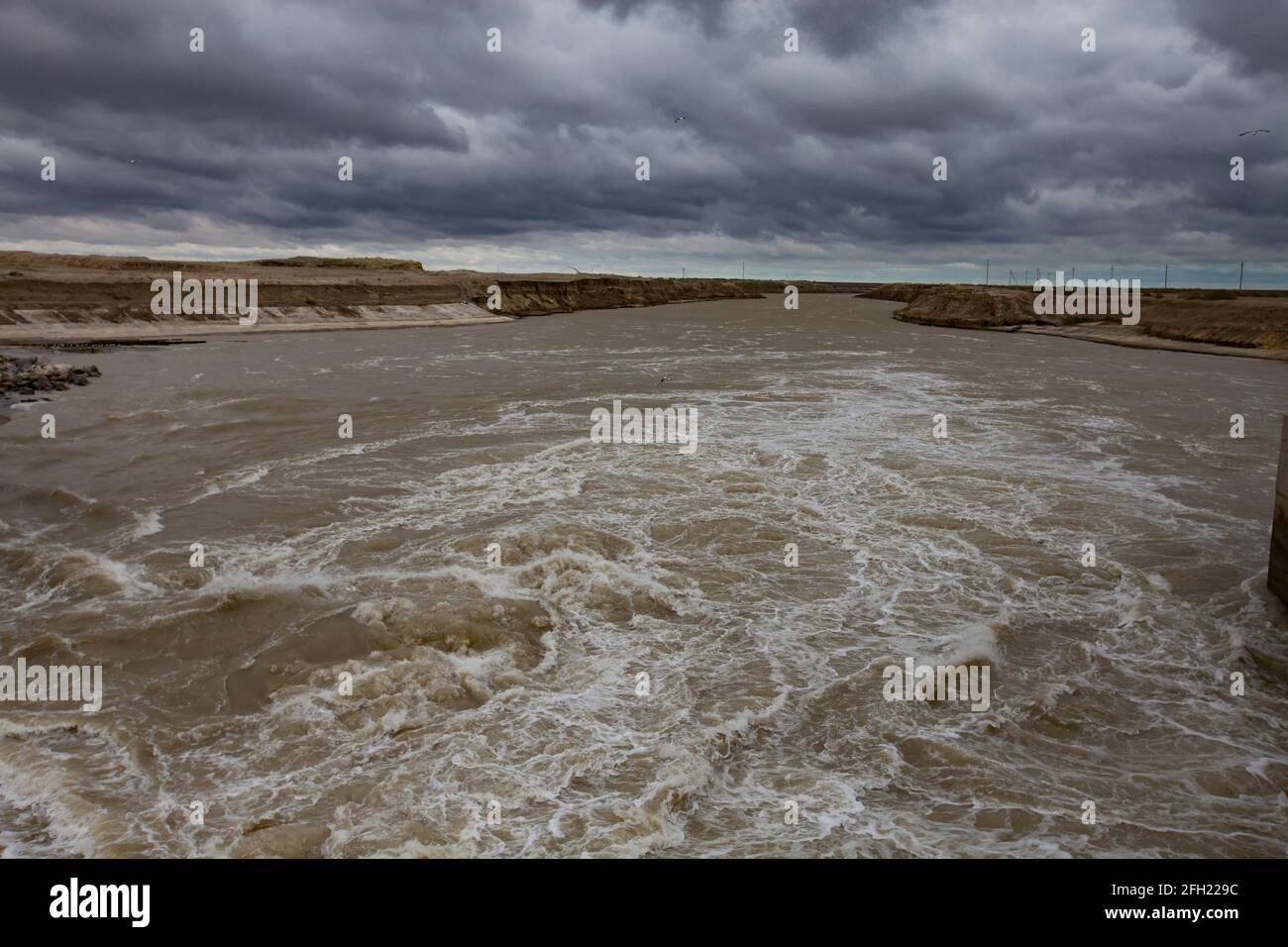 Kzylorda region, Kazakhstan. Aklak dam on Shardara river. turbulent ...