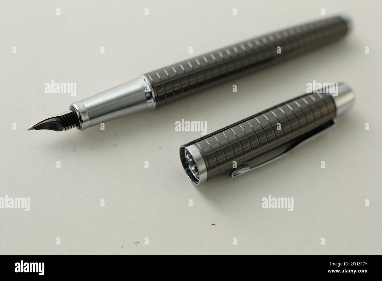 Beautiful grey fountain pen on white background Stock Photo - Alamy