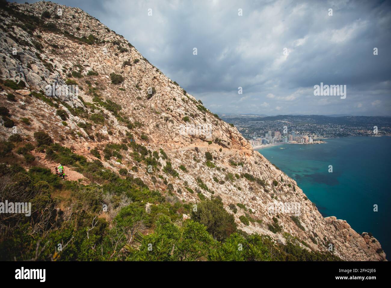 View of Calpe Calp town with Penon de Ifach mountain during the hiking ...