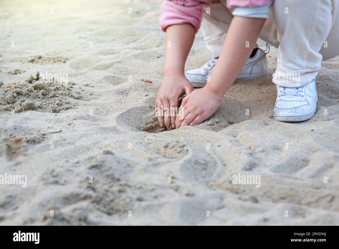 Hand playing in ocean hi-res stock photography and images - Alamy