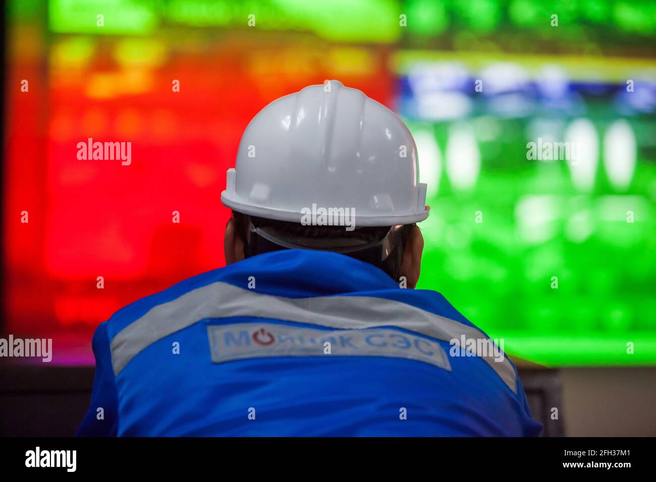 Moinak hydroelectric power station operator watching on screen ...