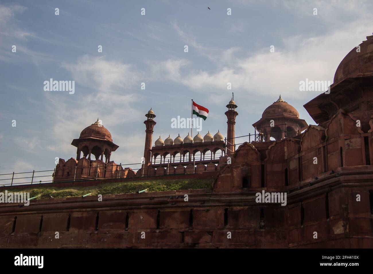 The Indian flag flies over the Red Fort in the Old Delhi sector of New ...