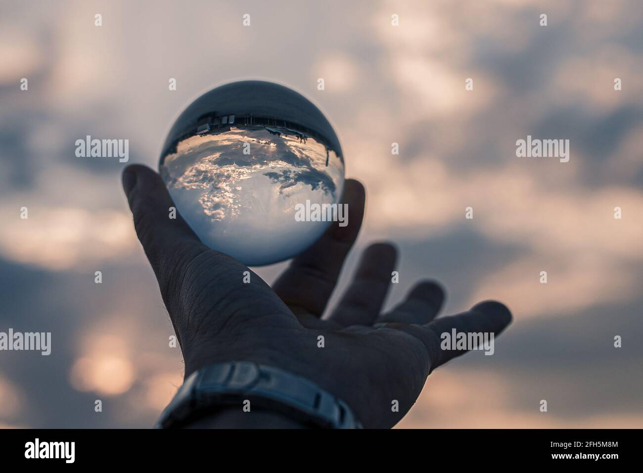 glass optical ball on the sandy azure coast of the sea Stock Photo - Alamy