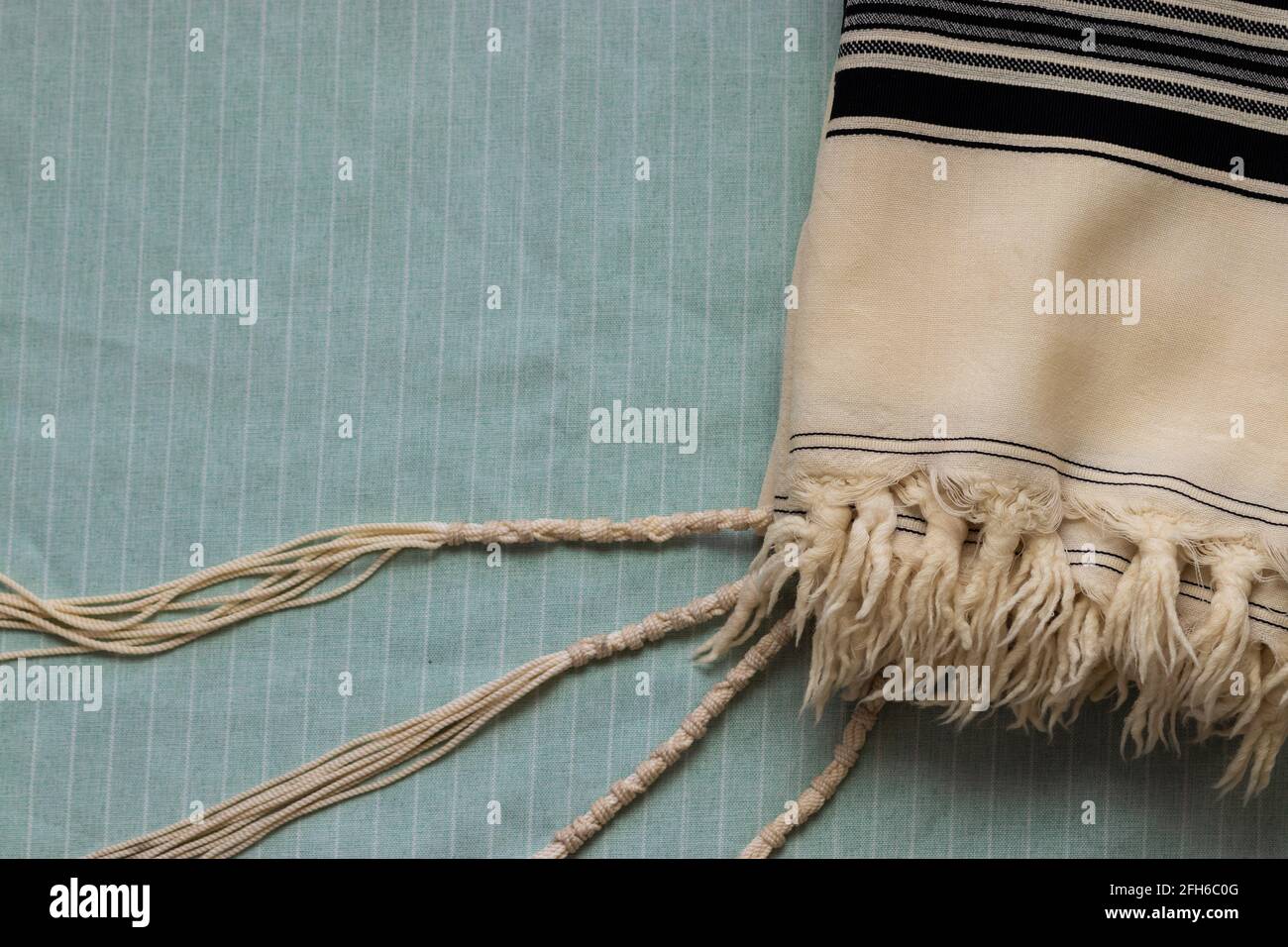 A close-up photo of a tallit, on a light background Stock Photo - Alamy