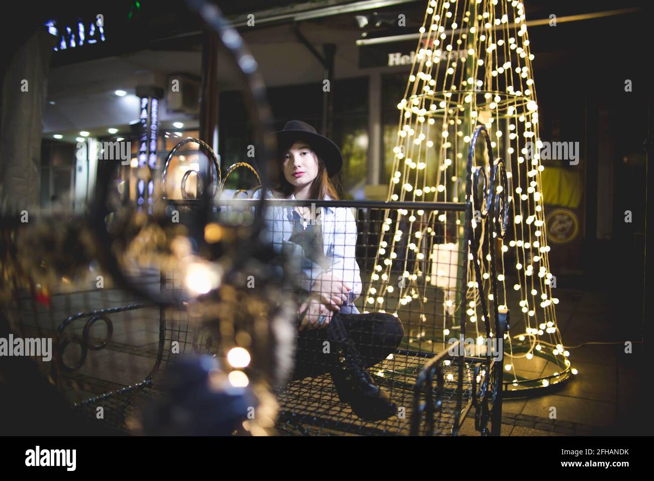 A Caucasian female posing outdoors at night Stock Photo - Alamy