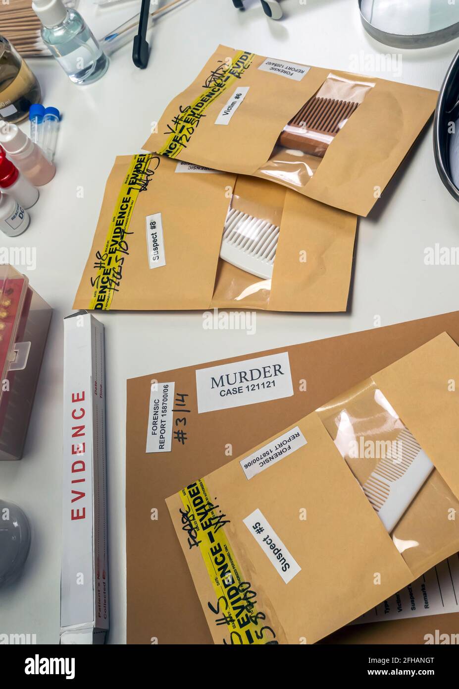 evidence bags with combs from a murder case, concept image Stock Photo ...