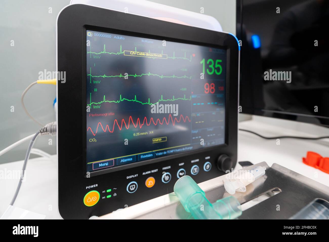 Professional medical device showing heart rate graphs and numbers on ...