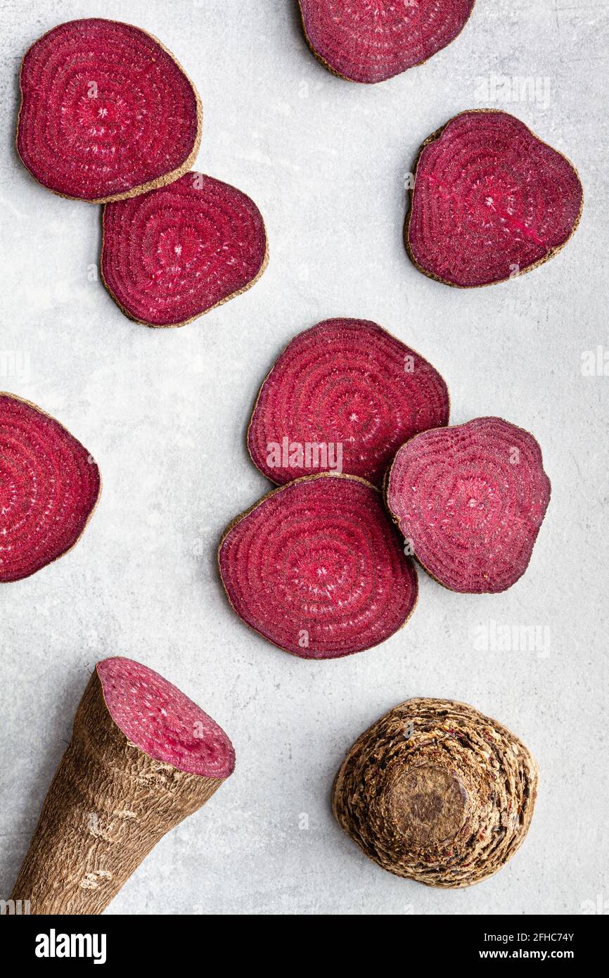 Overhead composition of organic natural beetroot cut into slices and ...