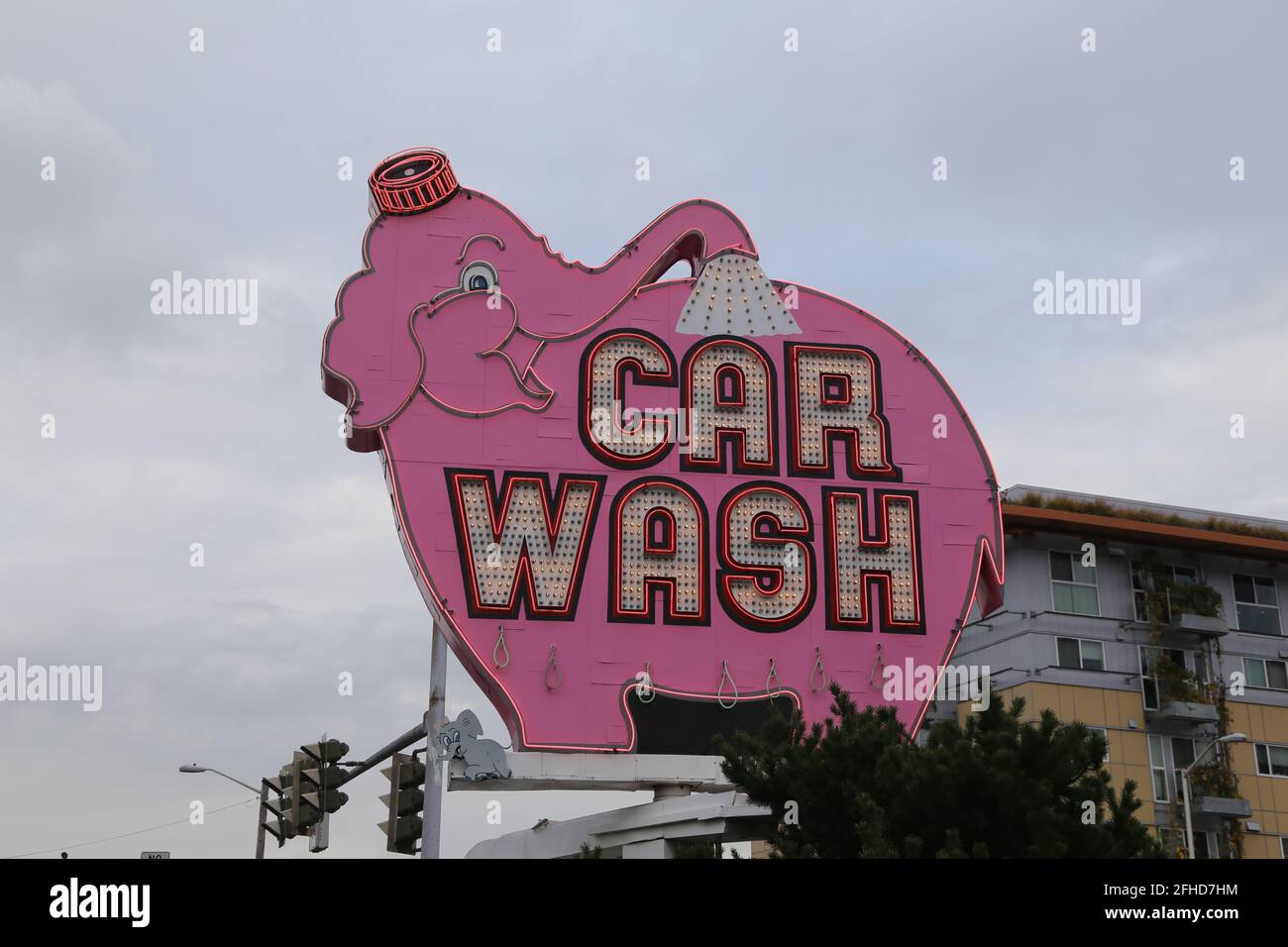 Pink elephant as a car wash sign Stock Photo - Alamy