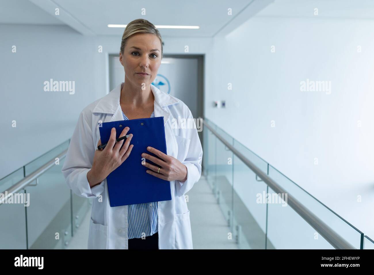 Doctor holding chart hi-res stock photography and images - Alamy