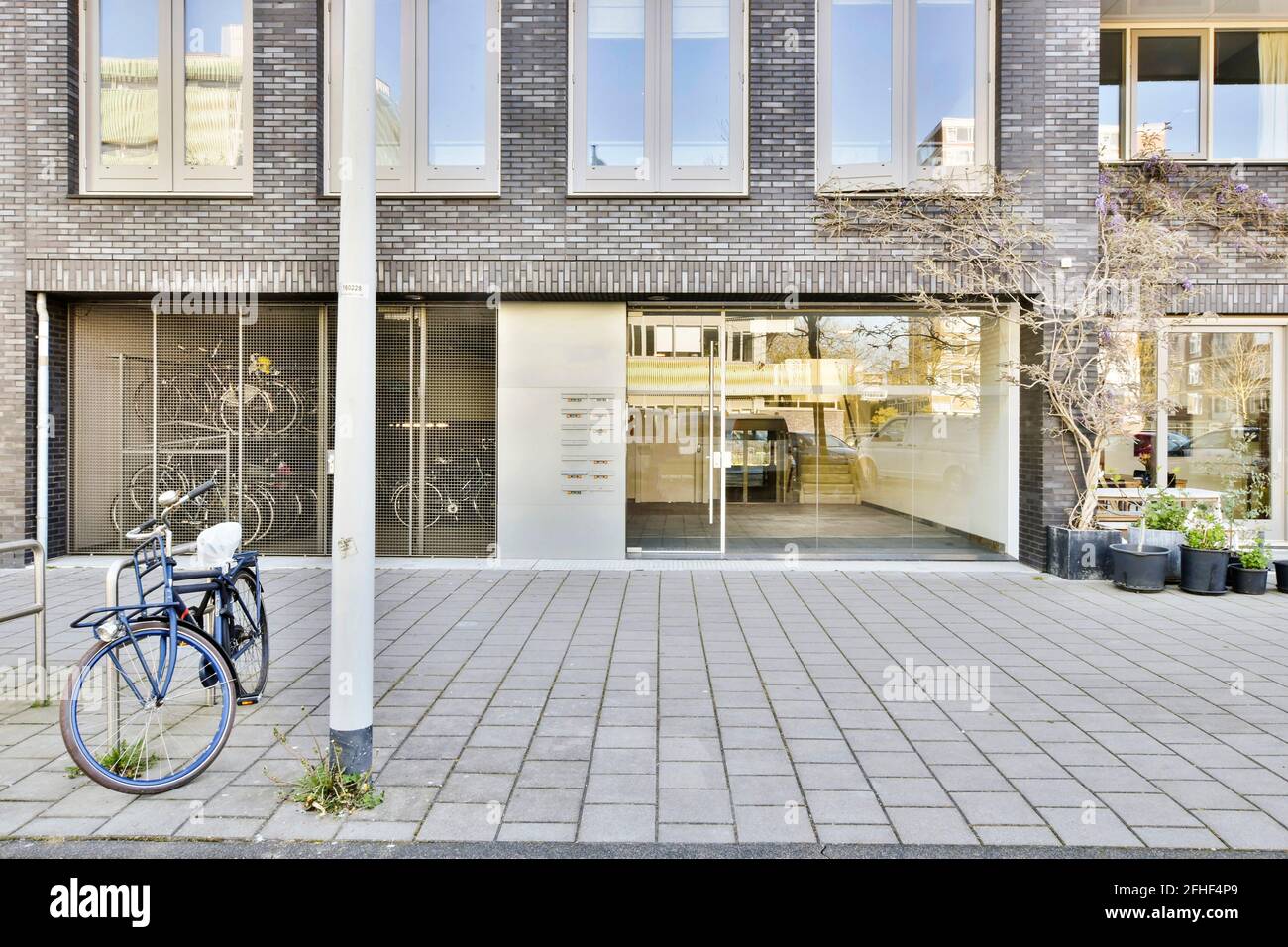 Pavement near modern apartment building Stock Photo - Alamy