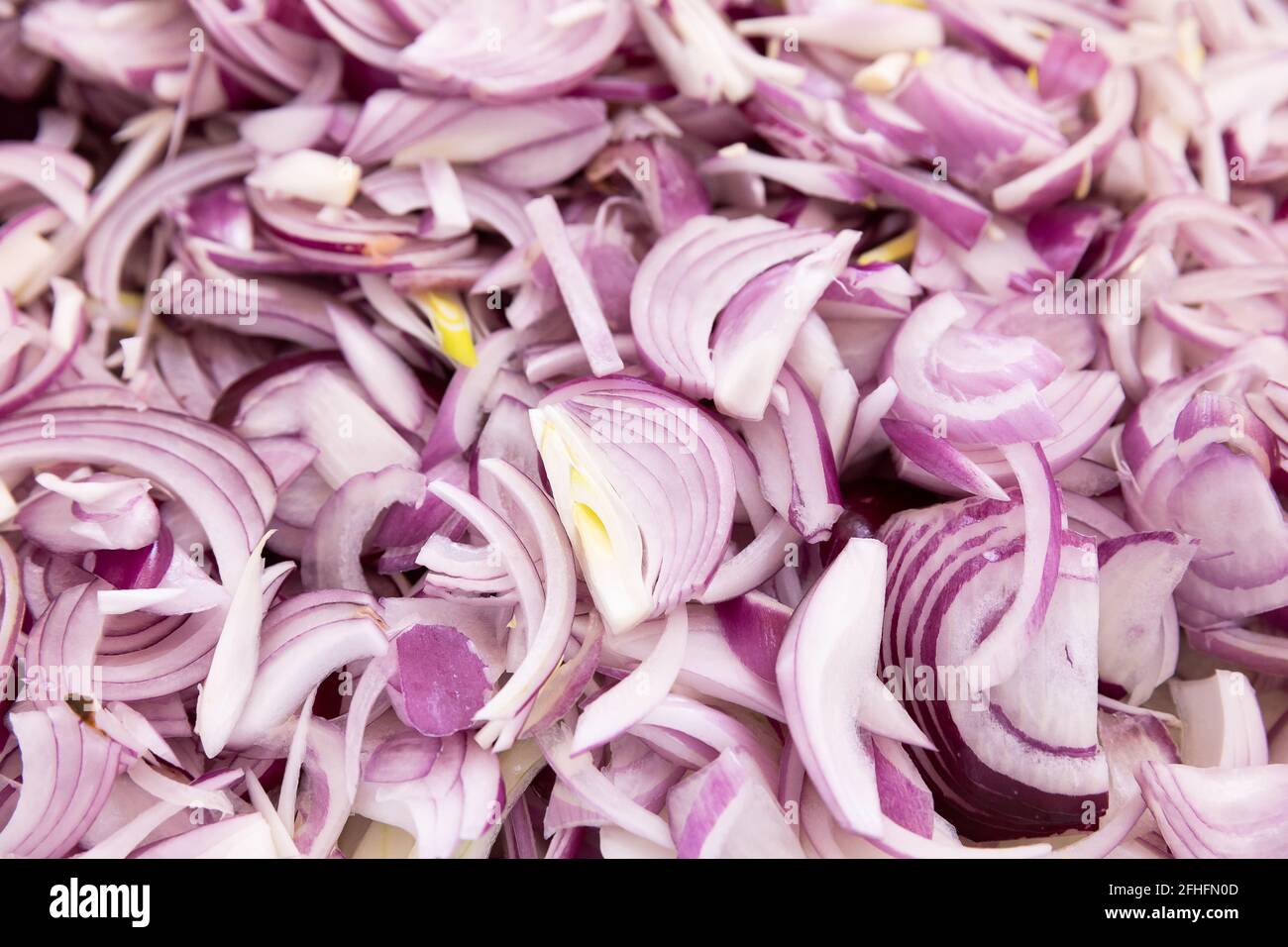 Red color indian onion sliced or chopped ready for cook, vegetable ...