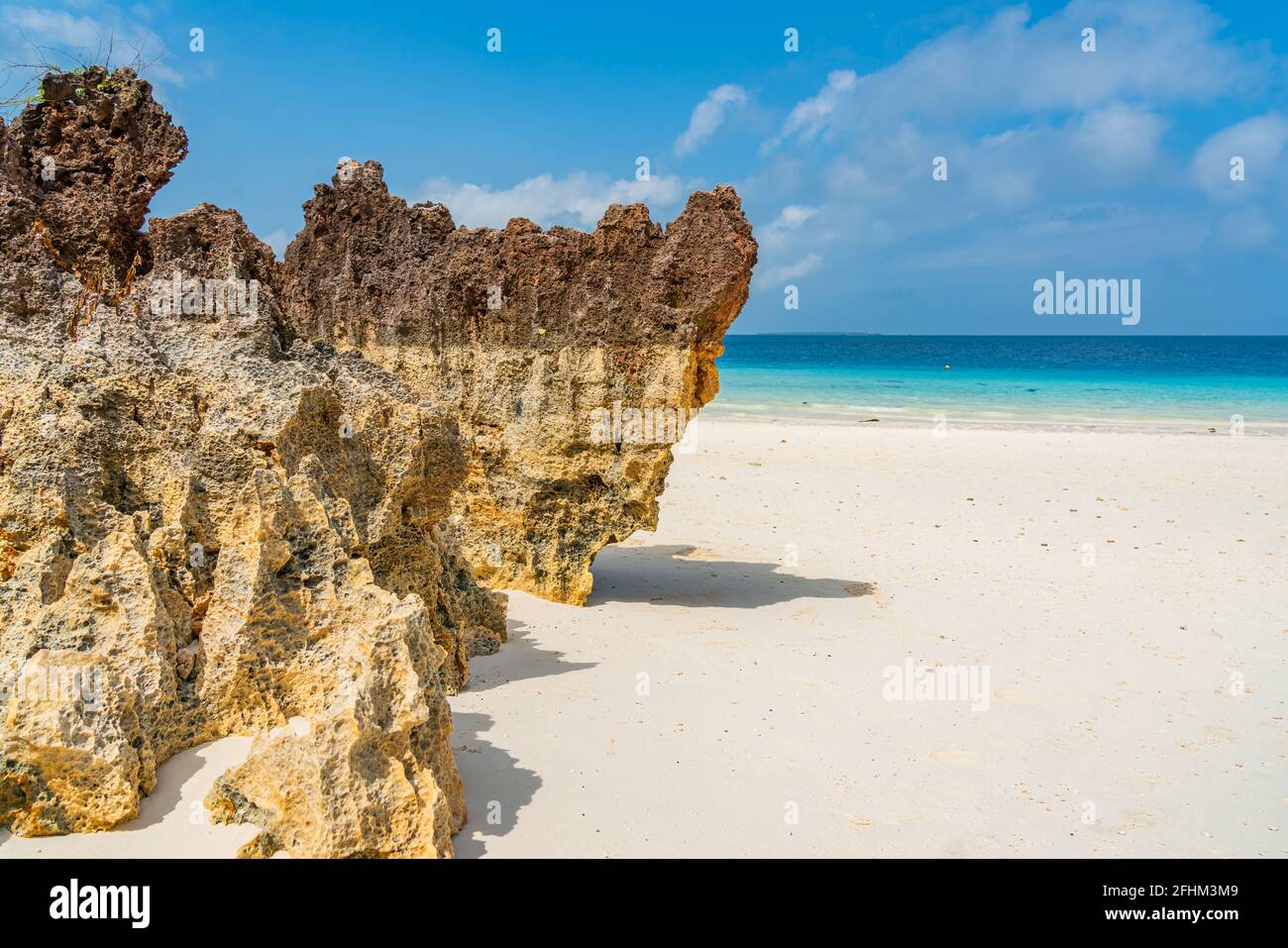 Tropical white beach of Zanzibar island with stone formations, Tanzania ...