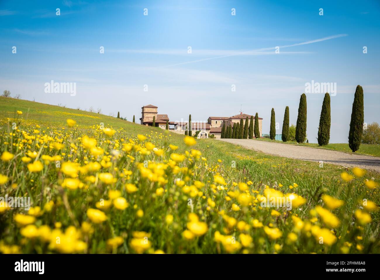 Beautiful view of a country house with flower meadows and driveway with ...