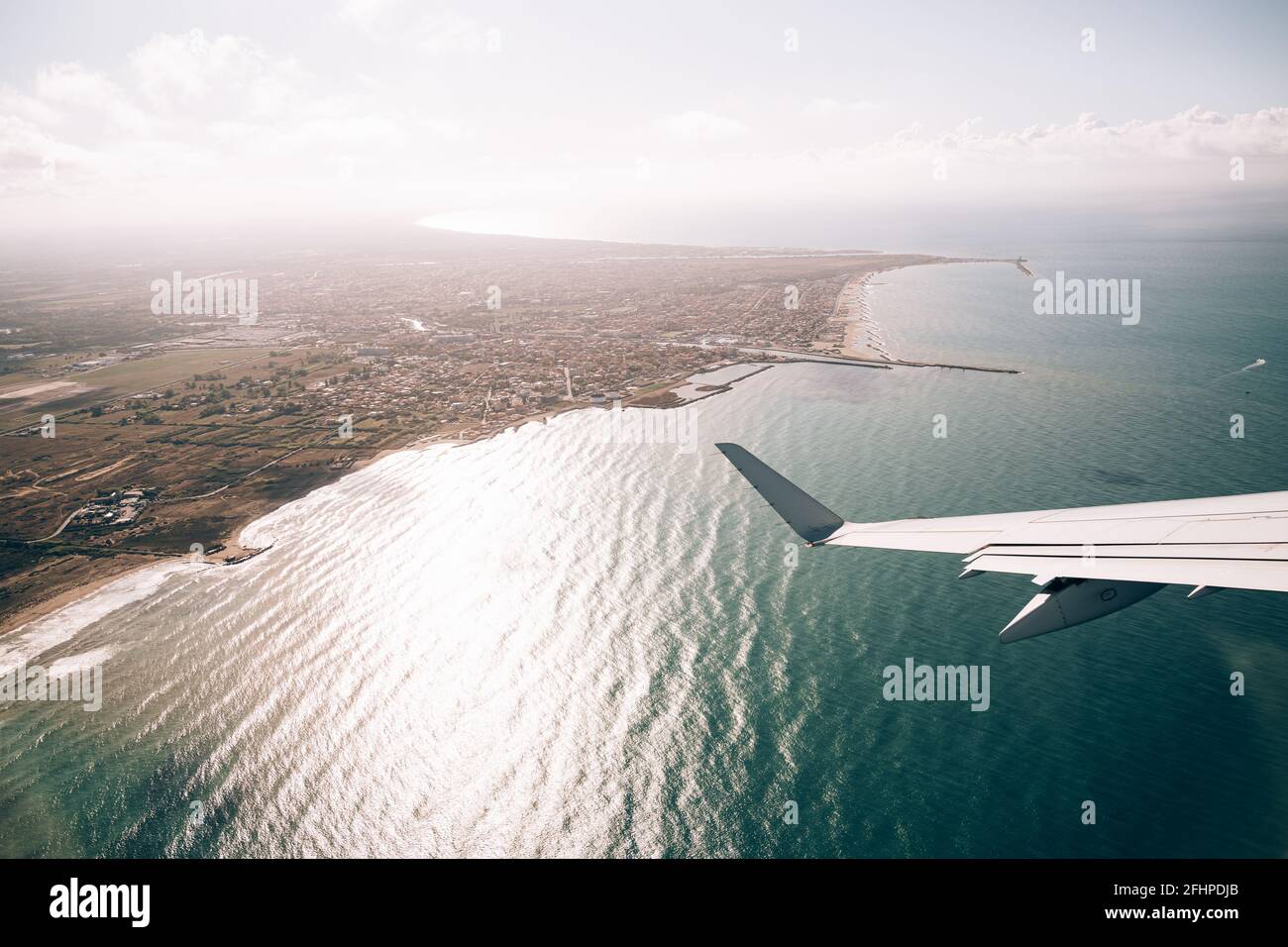 View from the plane's window of the east coast of Italy and the sea ...