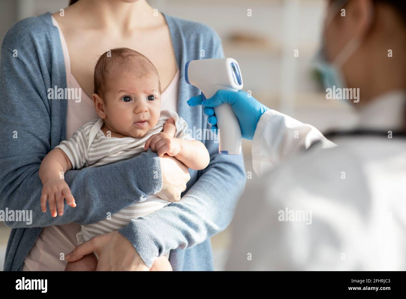 Healthcare And Children. Unrecognizable Nurse Checking Newborn Baby ...