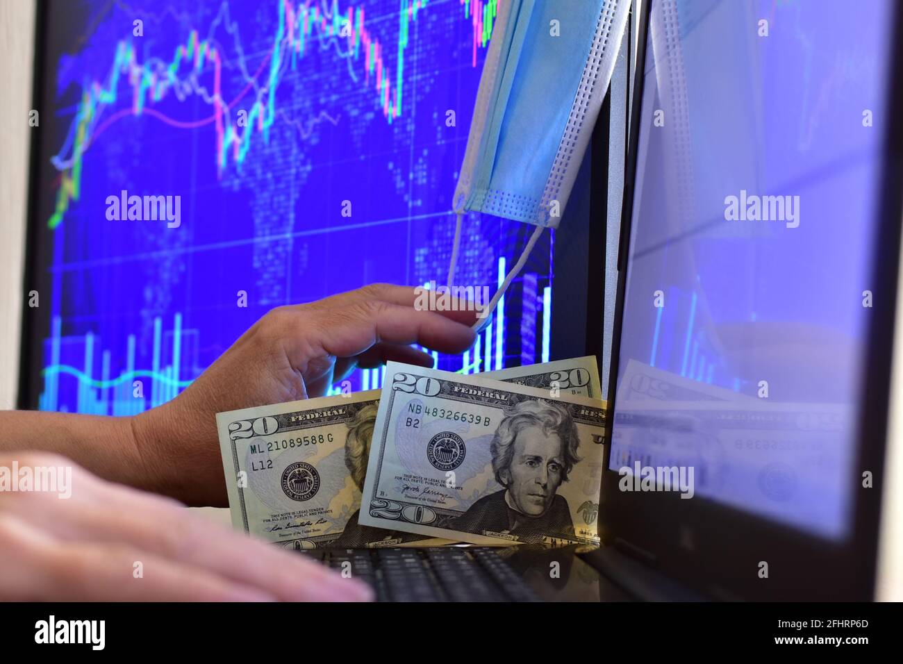 Disposable face mask on blurred background of computer screen and ...