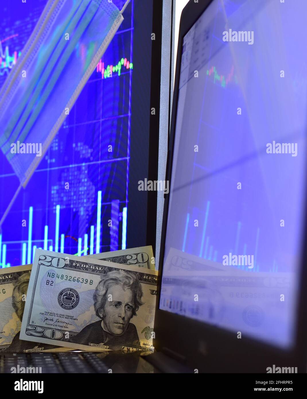 Disposable face mask on blurred background of computer screen and ...