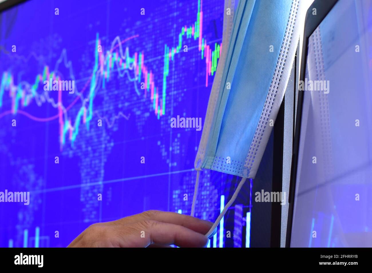 Disposable face mask on blurred background of computer screen and ...