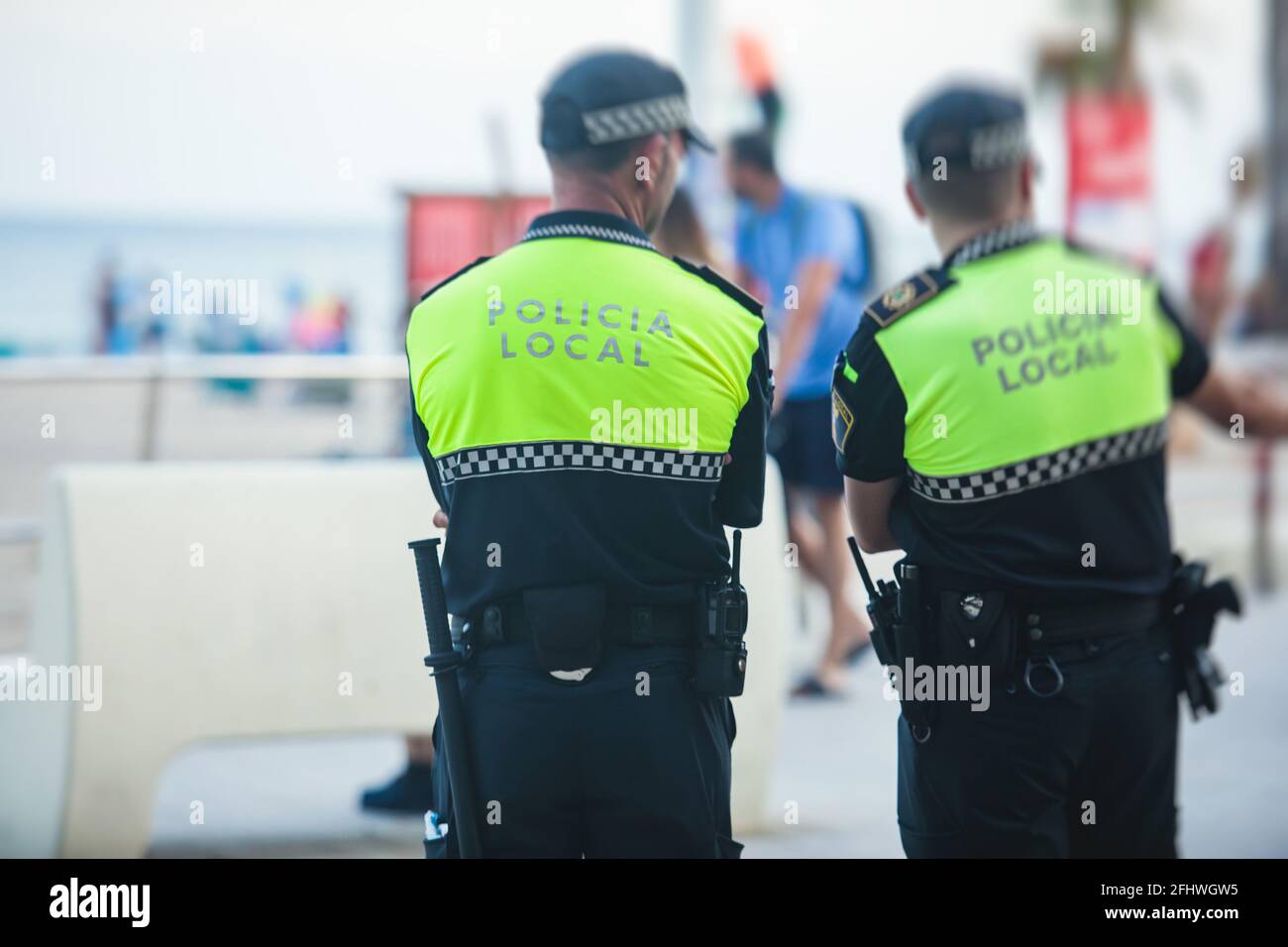 Spanish police squad formation back view with "Local Police" logo ...