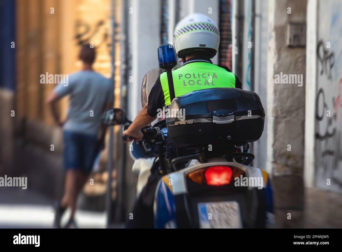 Spanish police squad formation on bike and motorcycle back view with ...