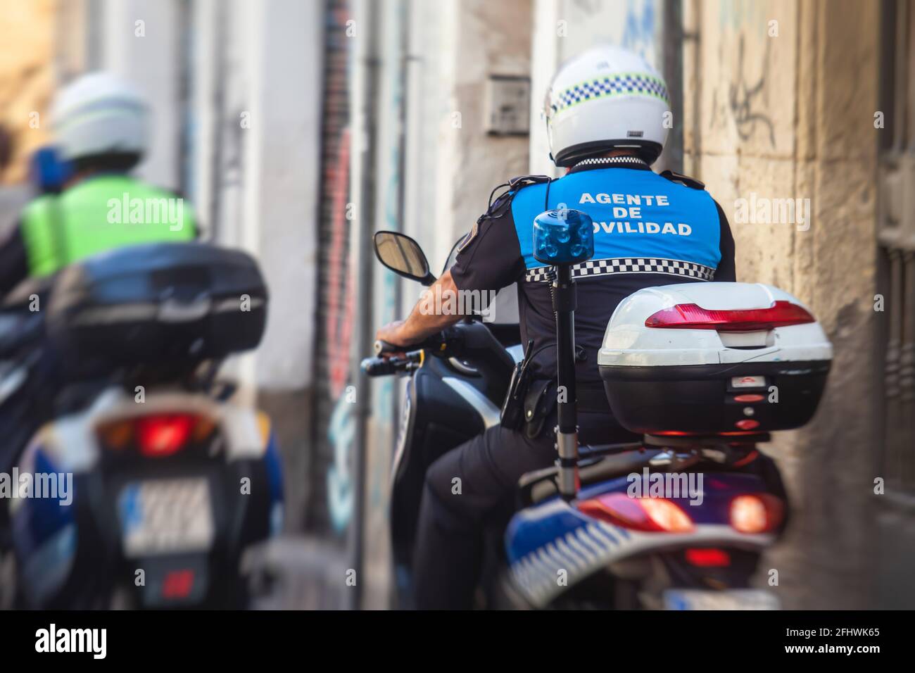 Spanish police squad formation on bike and motorcycle back view with ...