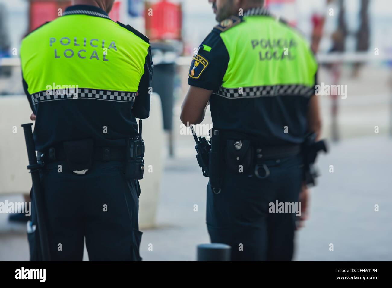 Spanish police squad formation back view with "Local Police" logo ...