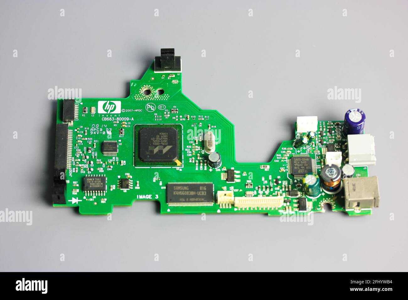 A green electronic circuit board flatly. Top view of pcb board circuit ...
