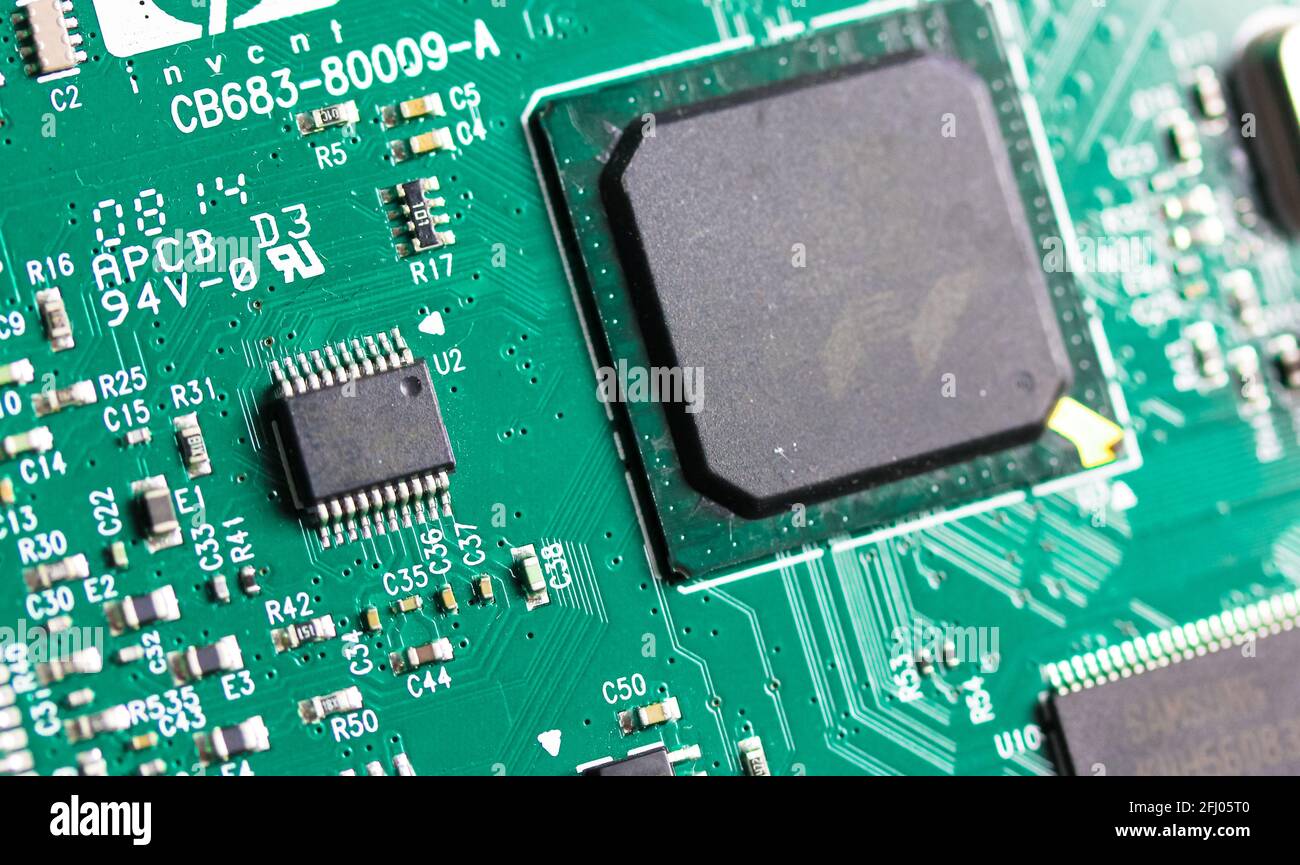 A green electronic circuit board flatly. Top view of pcb board circuit ...