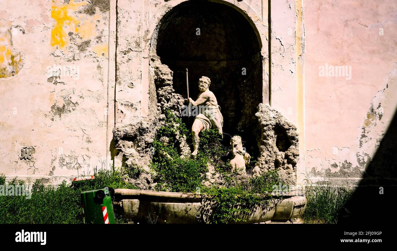ancient abandoned fountain with weeds and garbage buckets. abandonment ...