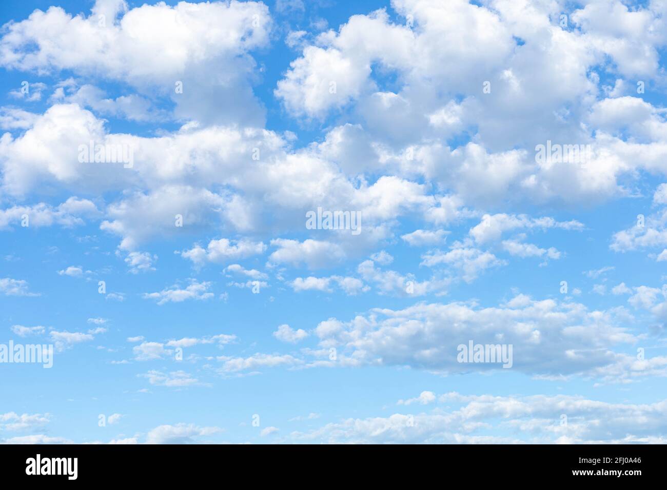 clear day with white cumulus clouds on a sunny day Stock Photo - Alamy