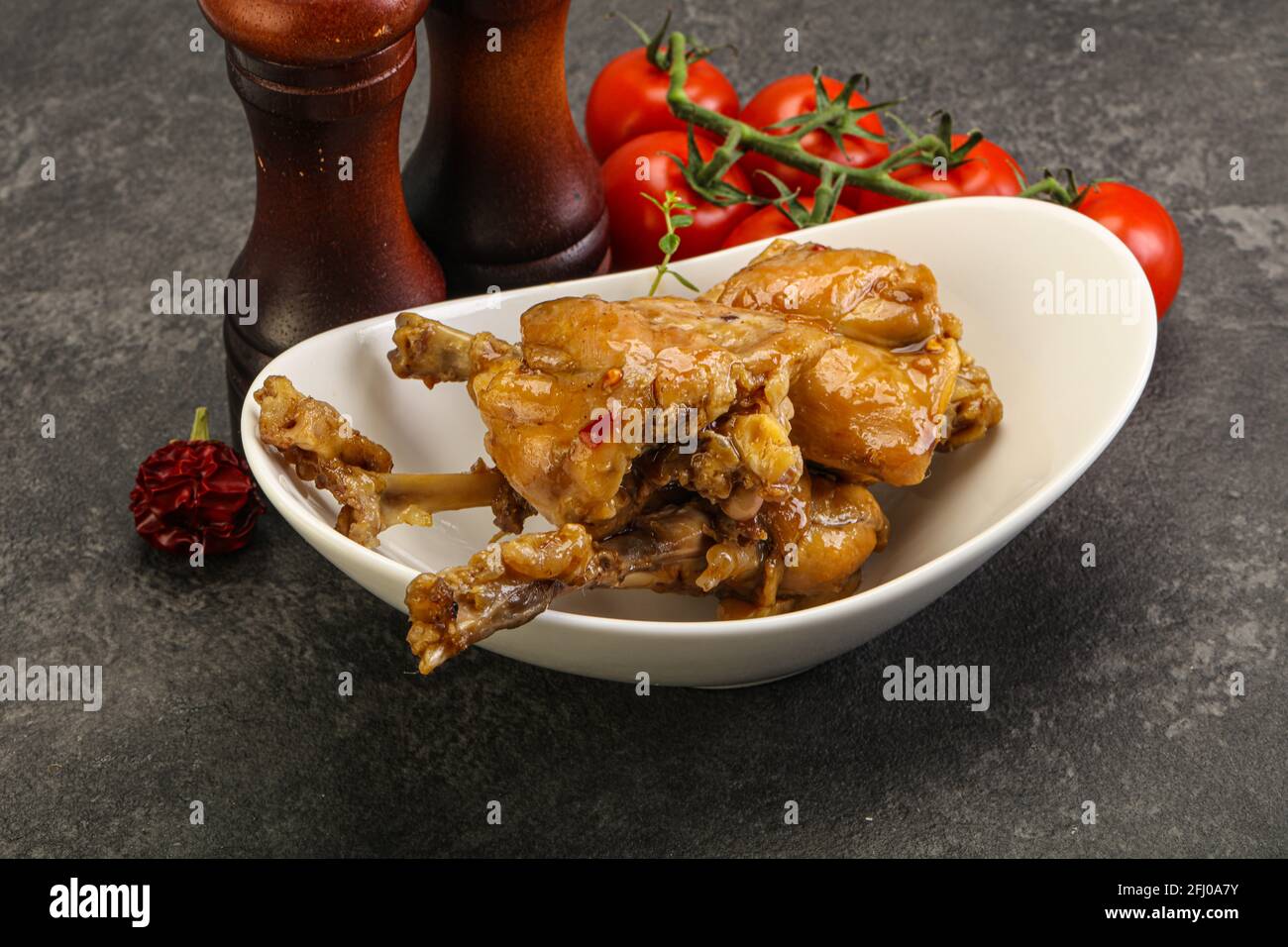 Rabbit stew in sweet and spicy sauce Stock Photo - Alamy