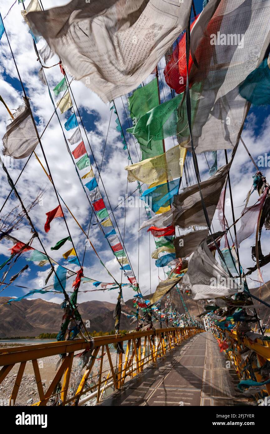 Buddhist Prayer Flags on a footbridge over the Brahmaputra River in ...