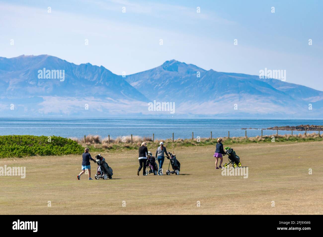 Portencross, Scotland, UK. 25th April 2021. UK Weather: Golfers playing ...