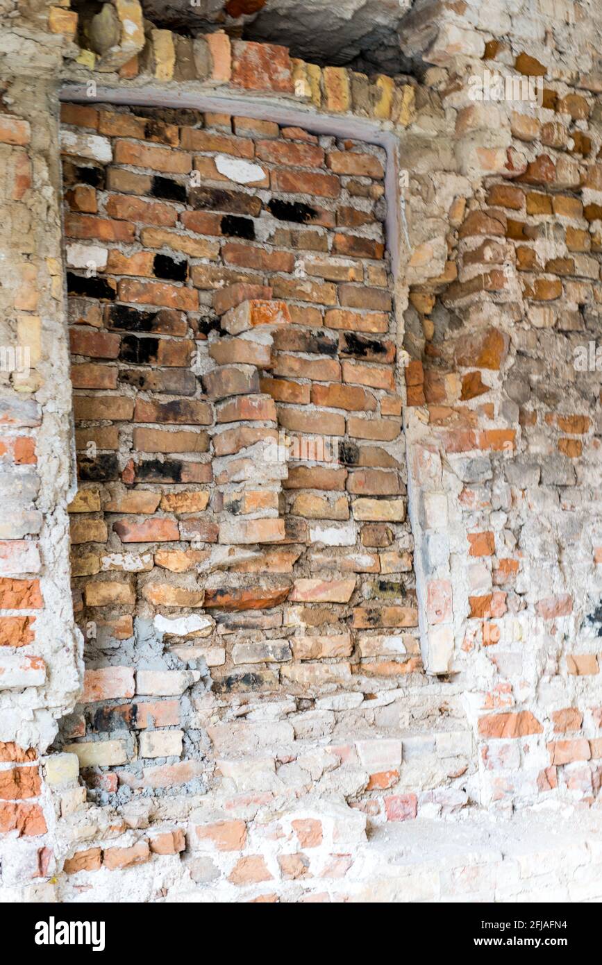 Very old, damaged red brick wall Stock Photo - Alamy