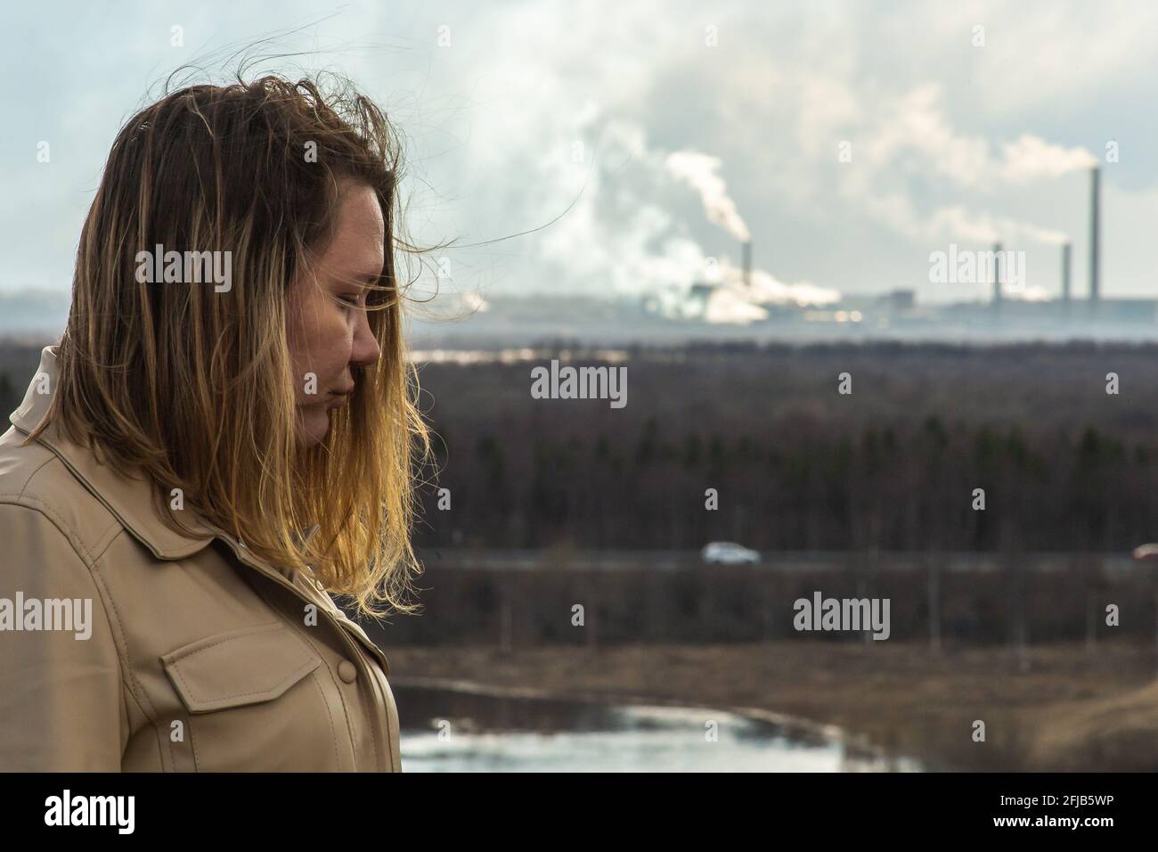 Air pollution pulp and paper mill and sad woman in the foreground Stock ...